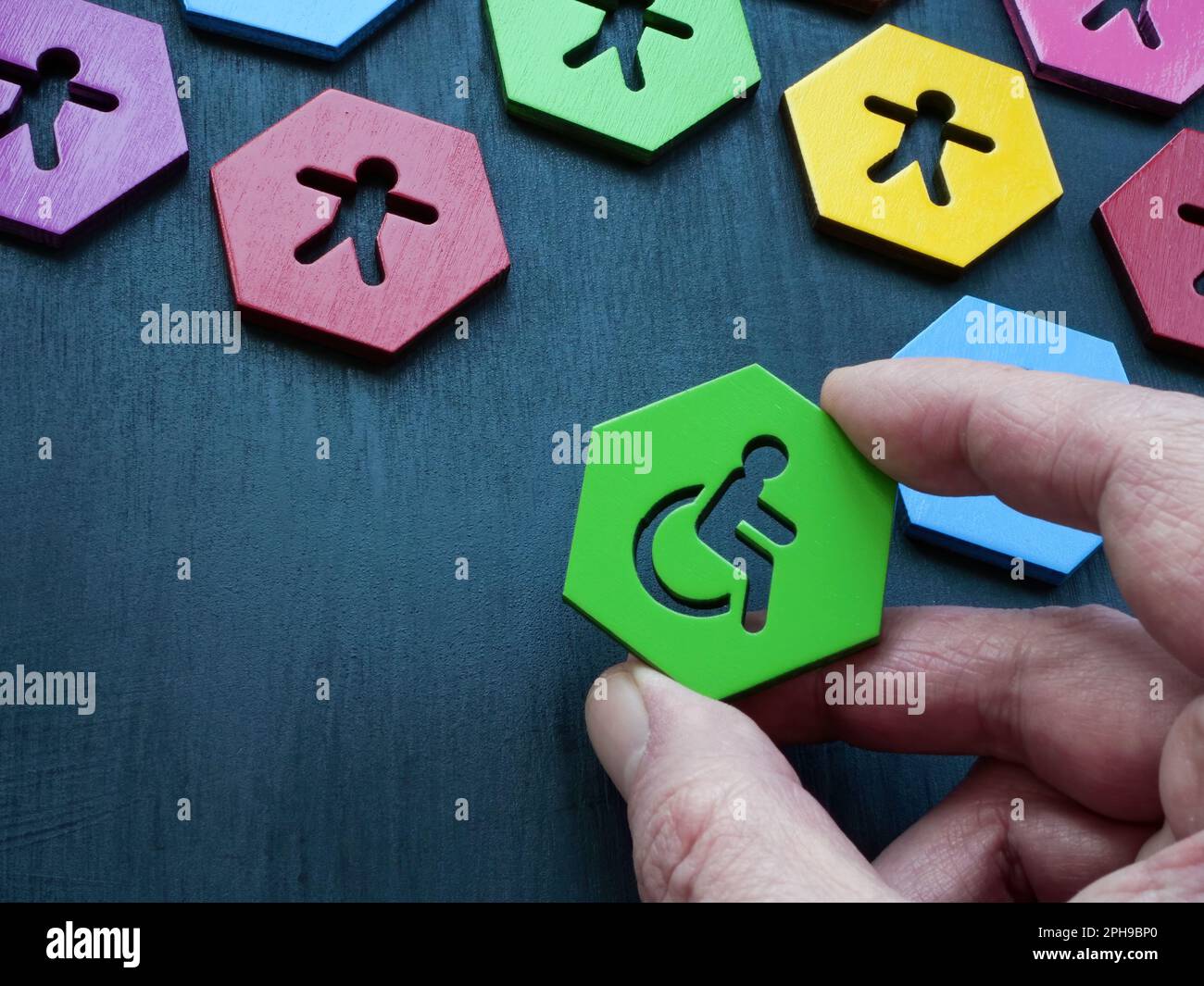 Hand holds disability person sign as concept of inclusion Stock Photo ...
