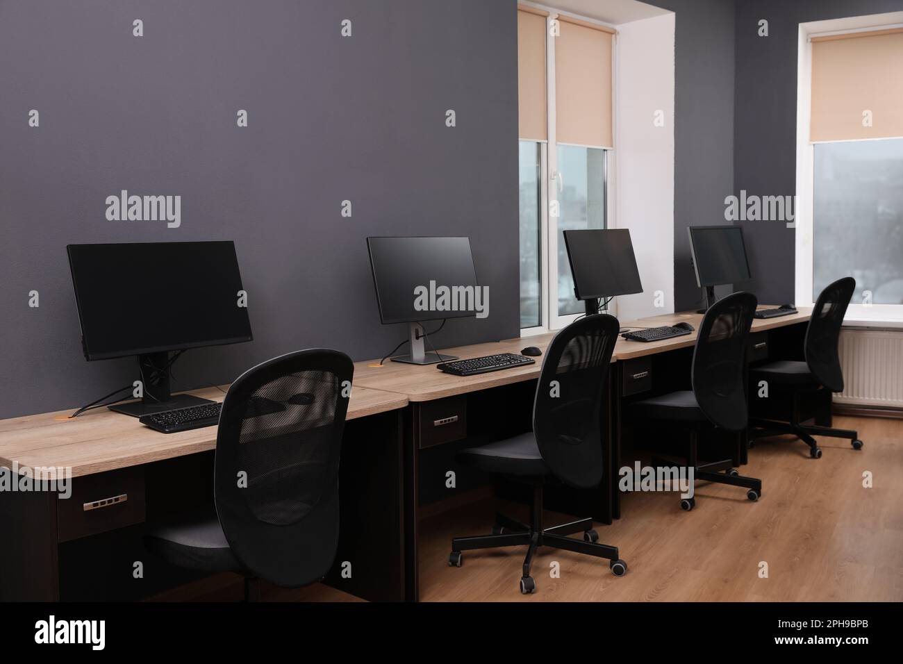 Many modern computers in open space office Stock Photo - Alamy