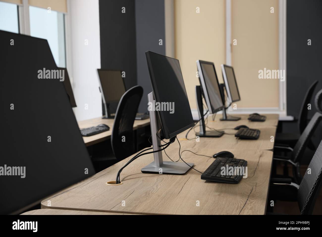 Many modern computers in open space office Stock Photo - Alamy