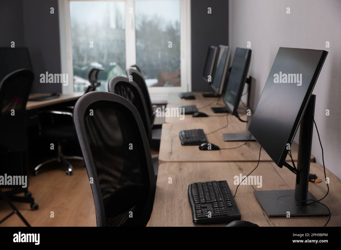 Many modern computers in open space office Stock Photo - Alamy