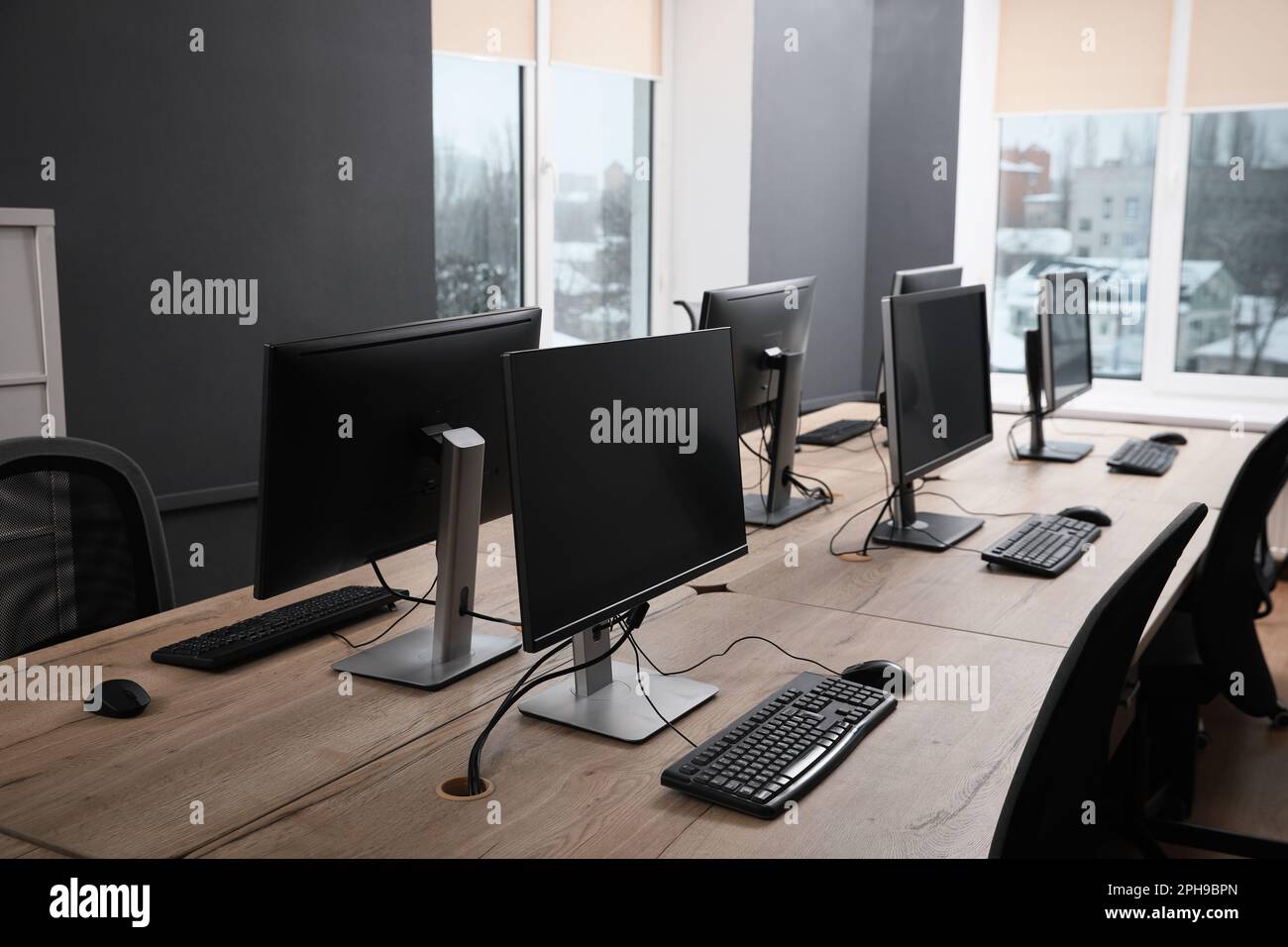 Rows of computers in empty office hi-res stock photography and images ...