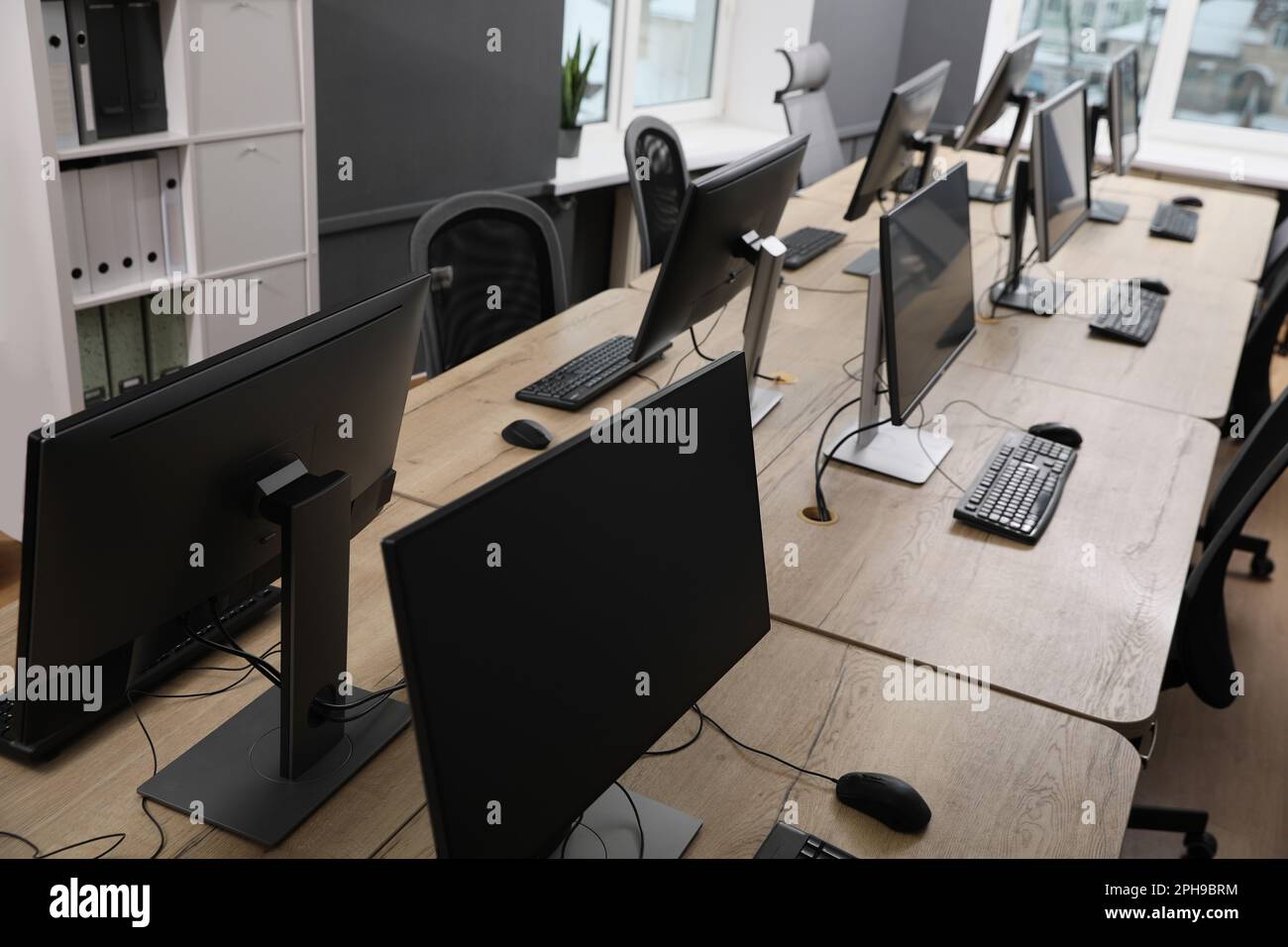 Many modern computers in open space office Stock Photo - Alamy