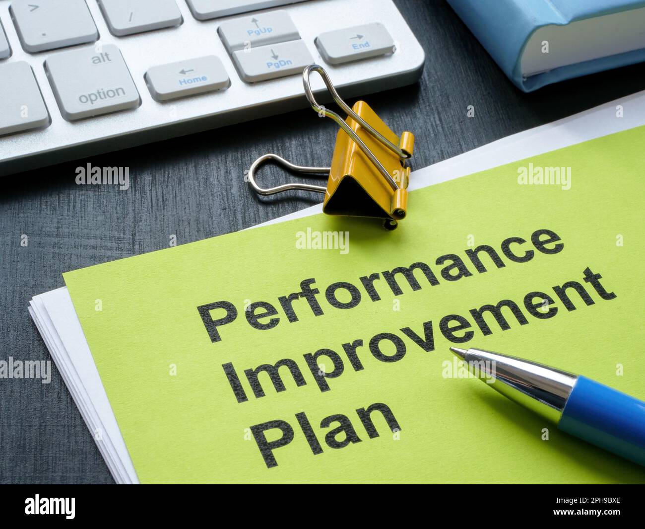 Stack of papers with Performance Improvement Plan PIP Stock Photo - Alamy