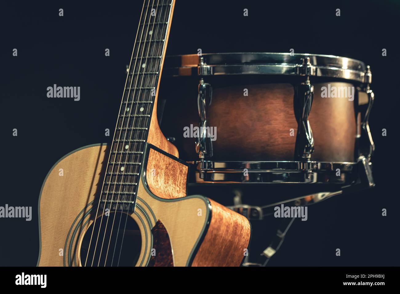 Acoustic guitar and snare drum on a black background isolated Stock ...