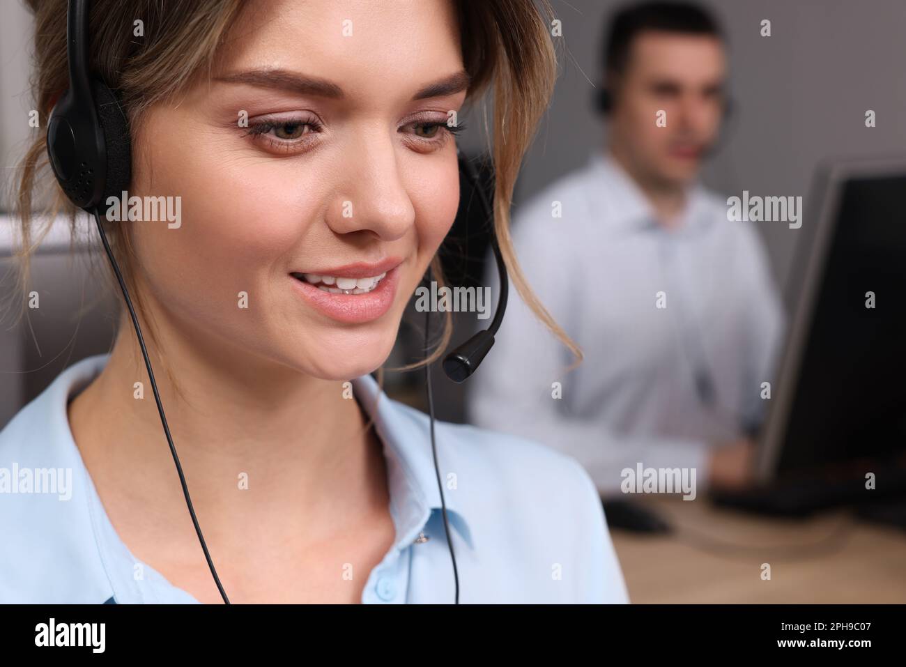 Call center young colleagues headset hi-res stock photography and images - Alamy