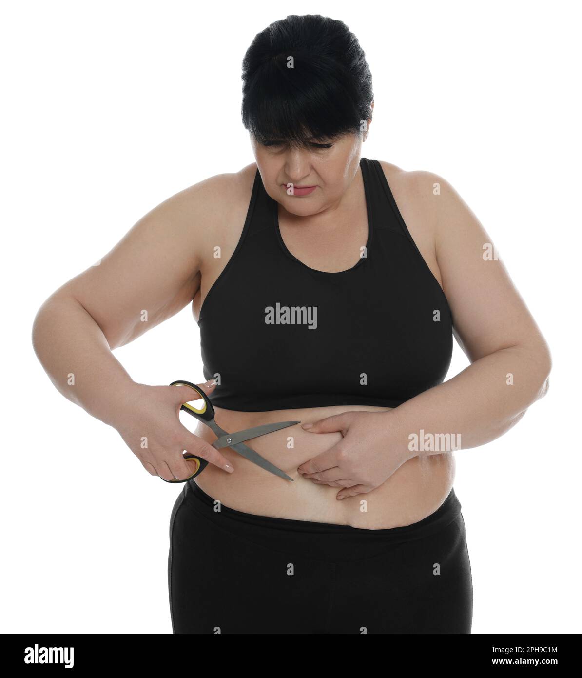 Obese woman with scissors on white background. Weight loss surgery ...