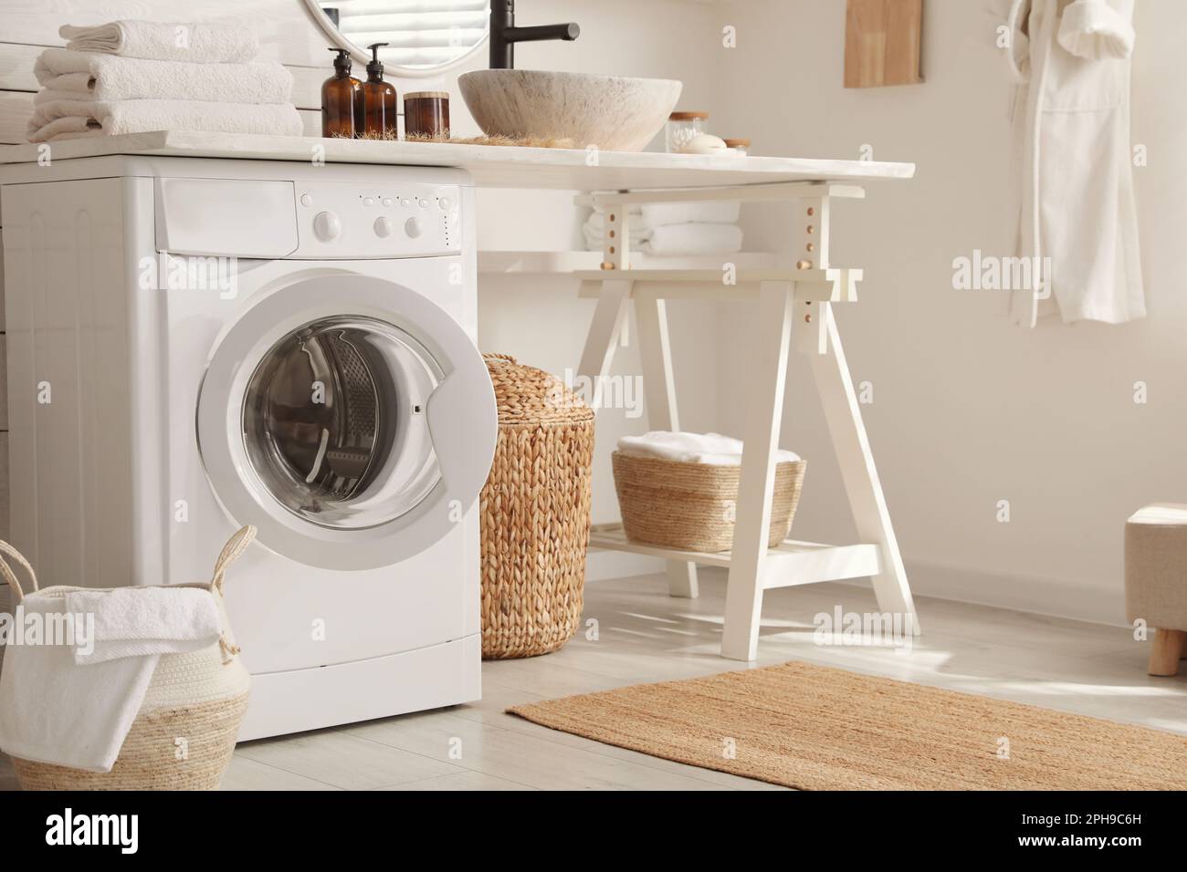 Stylish bathroom interior with modern washing machine Stock Photo - Alamy