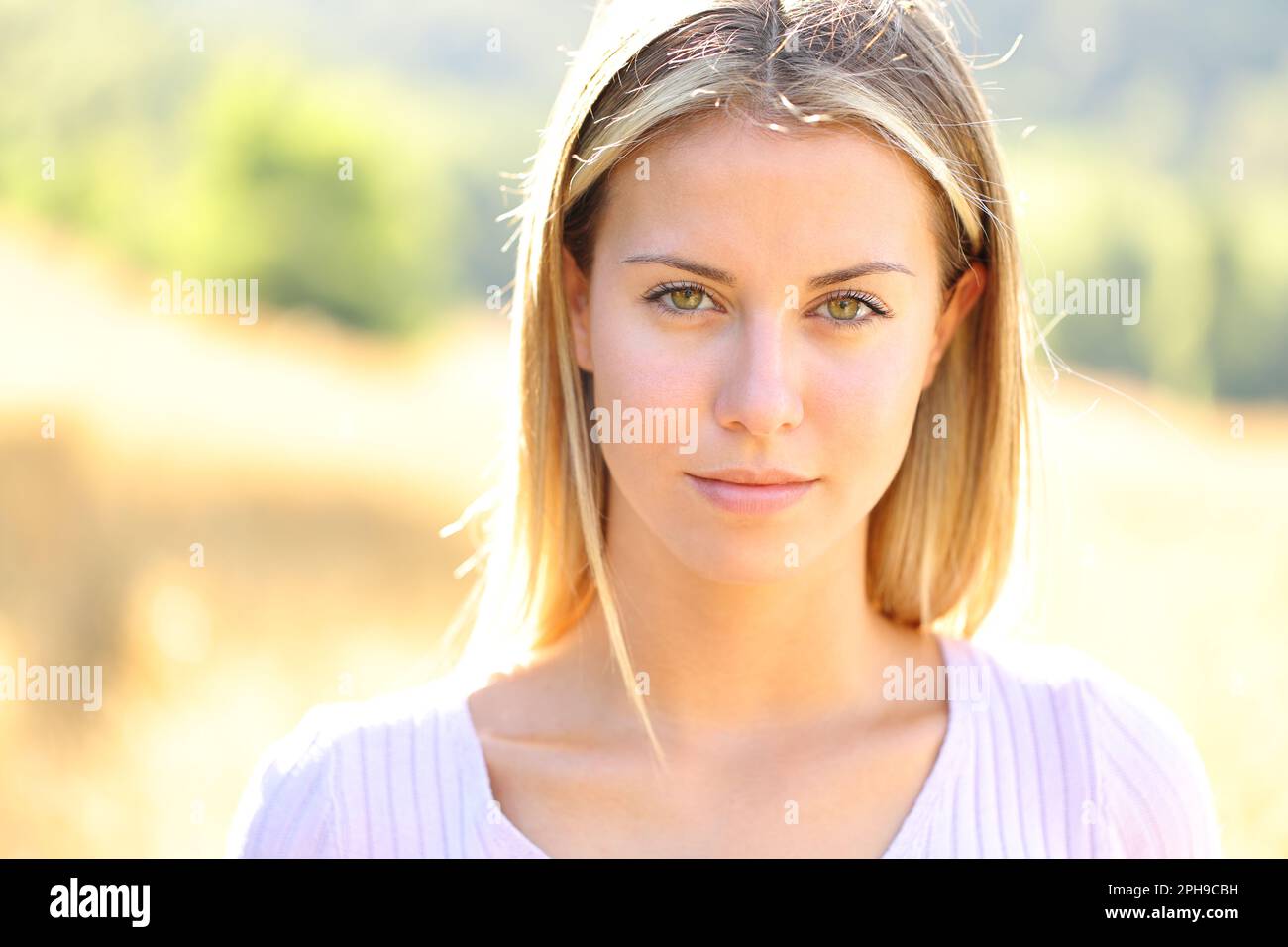 Front view portrait of a beauty portrait of a teen posing in nature ...