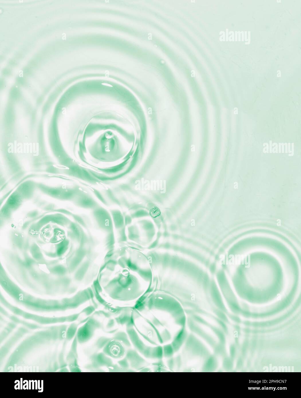 Abstract green water, cosmetic background with rings, water surface ...