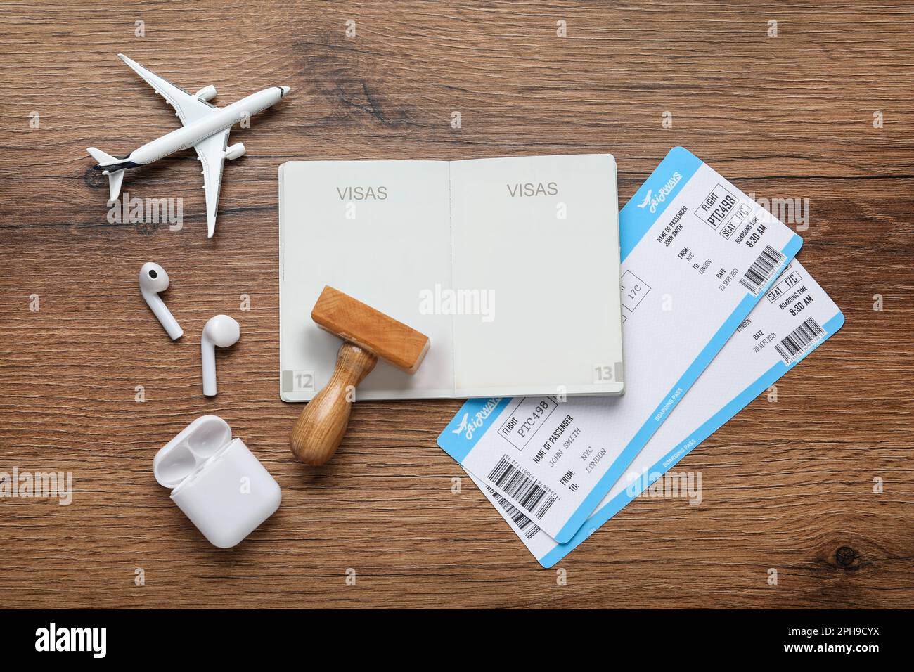 Flat lay composition with passport, stamp and flight tickets on wooden ...