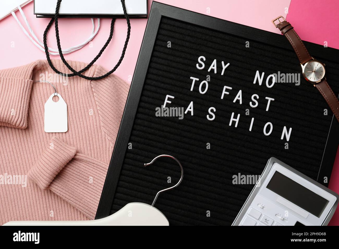 Black letter board with phrase SAY NO TO FAST FASHION, clothes ...