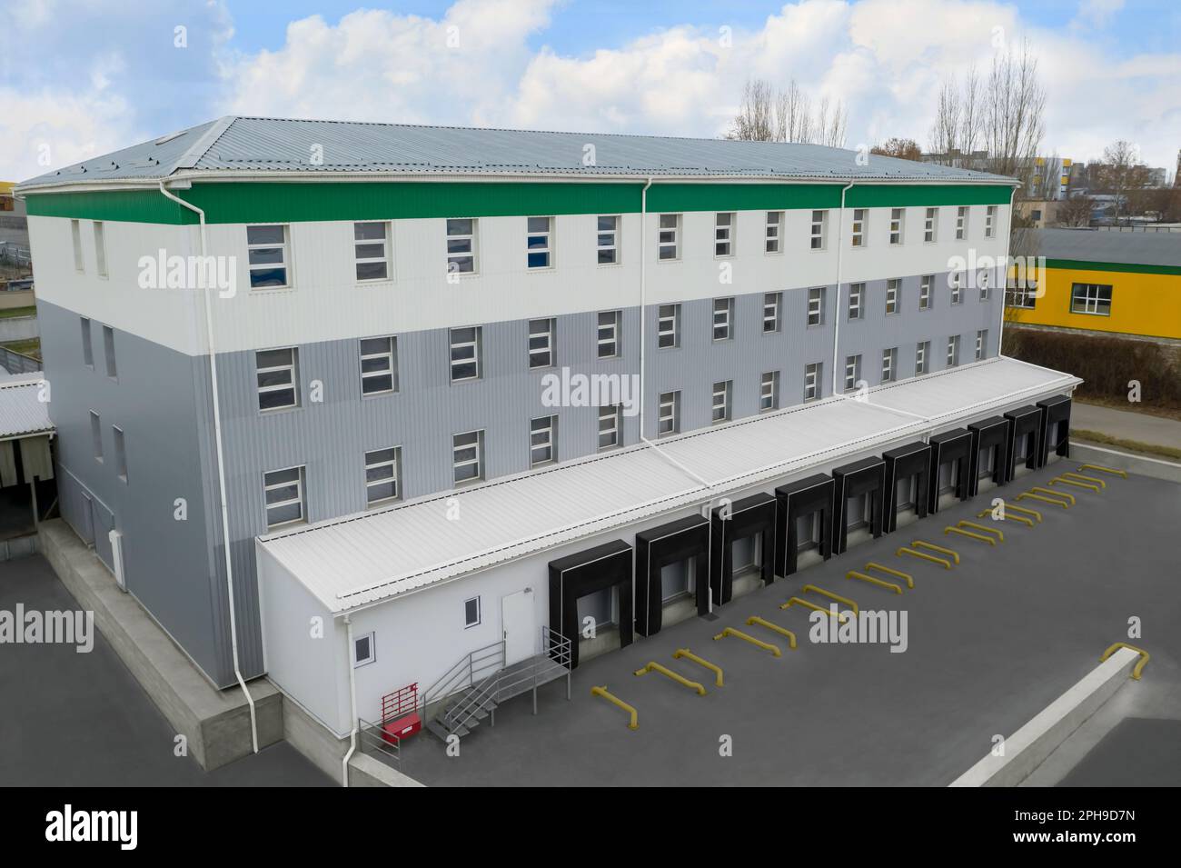 Warehouse with loading docks outdoors, aerial view. Logistics center ...