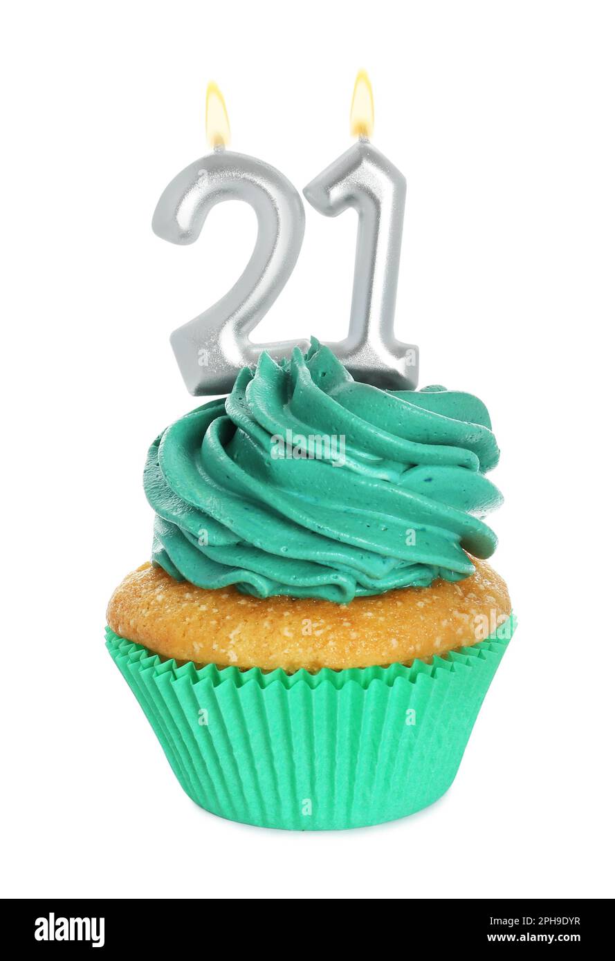 Delicious cupcake with number shaped candles on white background ...