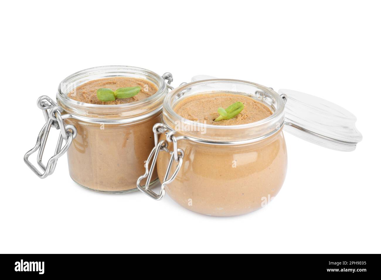 Glass jars with delicious liver pate on white background Stock Photo ...