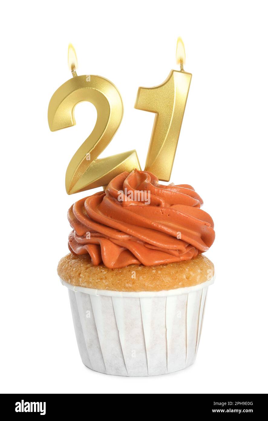 Delicious cupcake with number shaped candles on white background ...