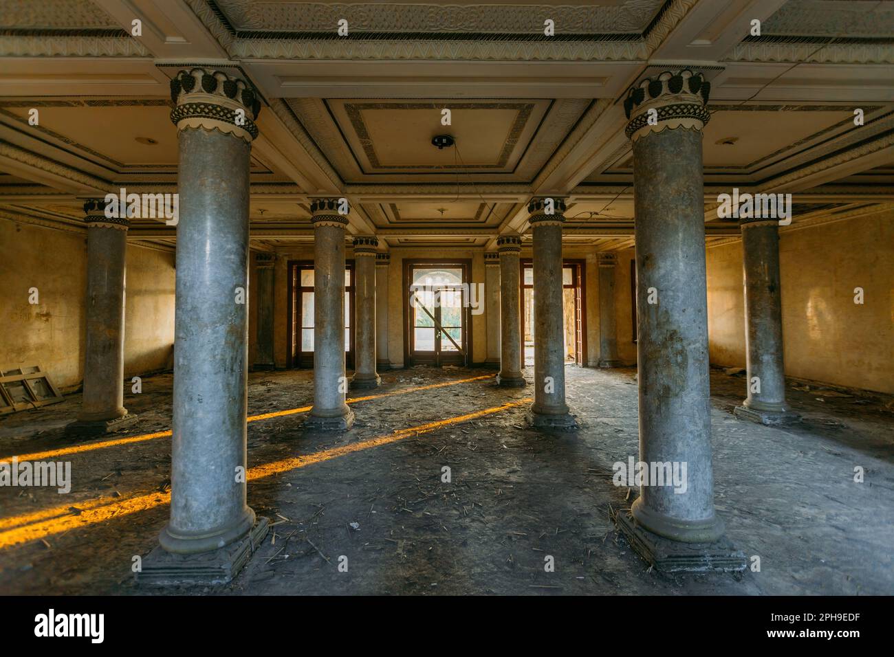 Large hall with columns in old abandoned mansion Stock Photo - Alamy