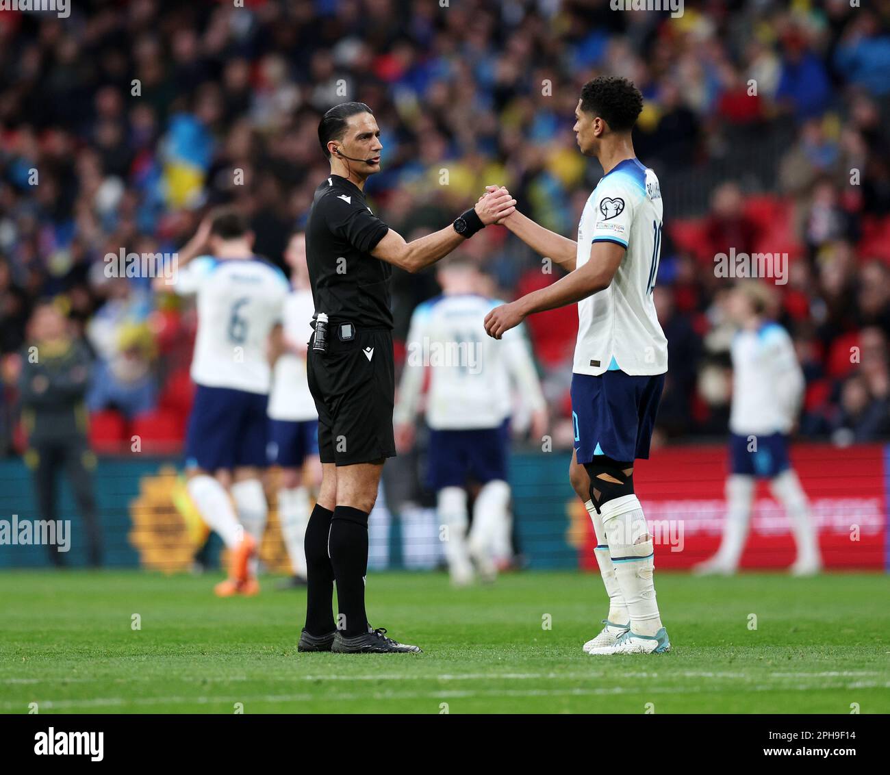 London, UK. 26th Mar, 2023. Referee Serdar Gozubuyuk with Jude ...