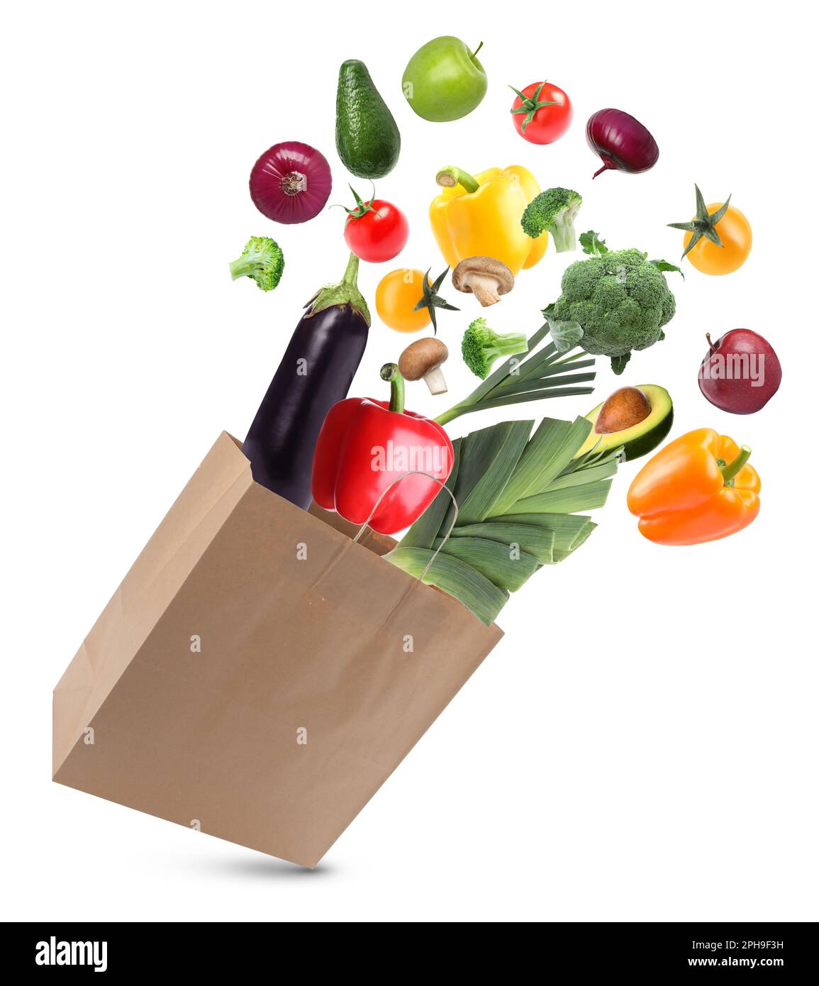 Kraft paper bag with different fruits and vegetables on white ...