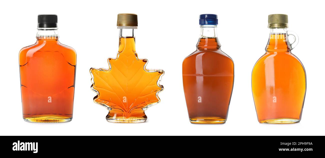 Set with bottles of tasty maple syrup on white background. Banner ...