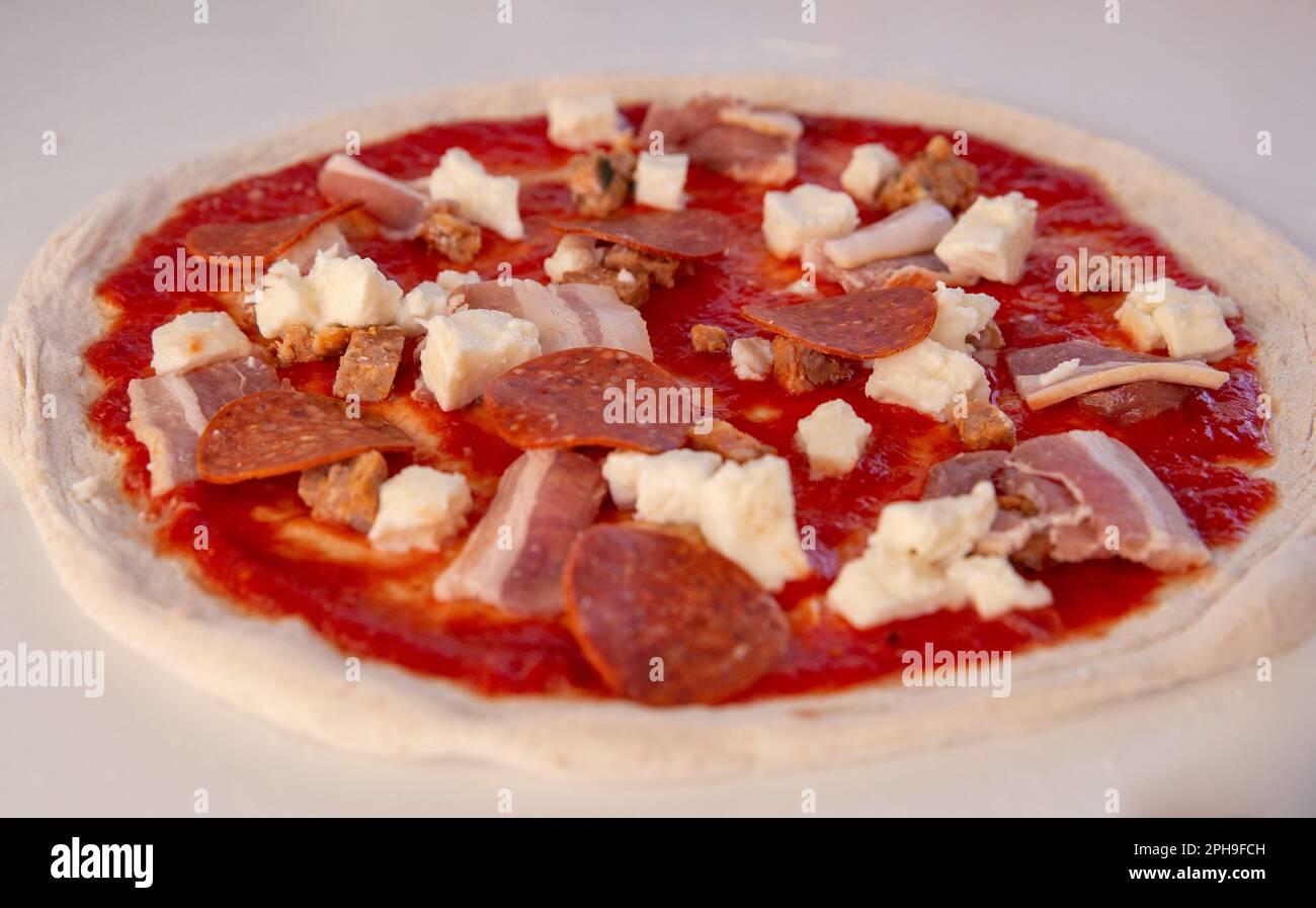 Bacon and pepperoni Pizza with chunks of cheese Stock Photo - Alamy