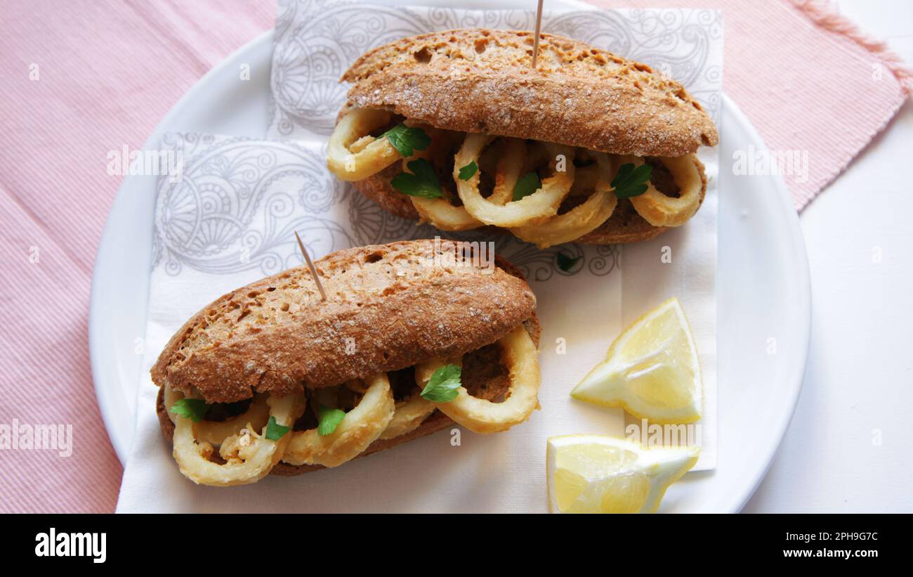 Delicious sandwich with calamari. Traditional recipe from Madrid Stock ...
