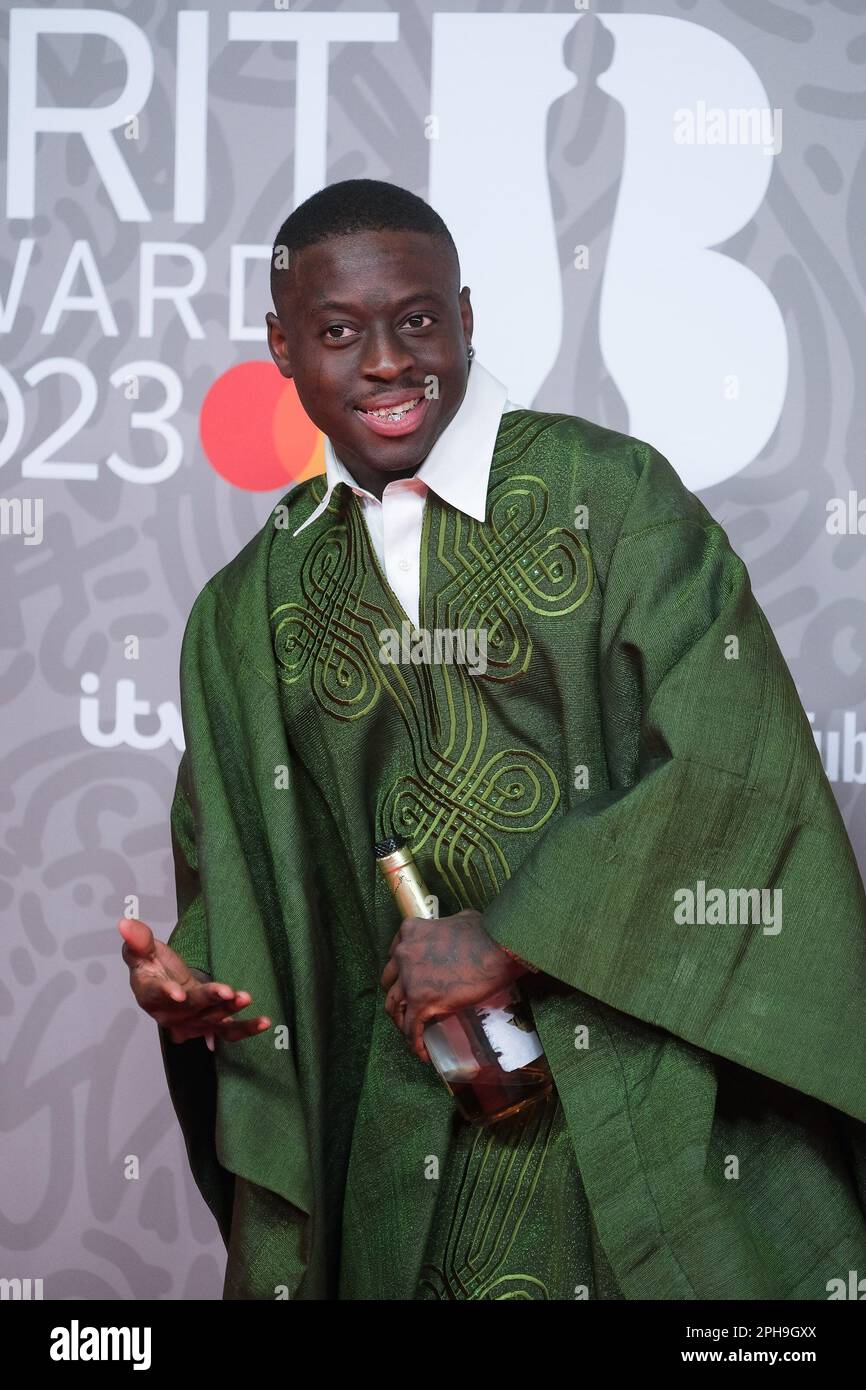 Olaolu Slawn photographed attending The BRITS Red Carpet Arrivals at ...