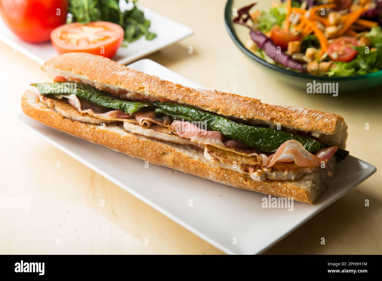 Serranito Sandwich. Typical Spanish sandwich with pork loin, bacon and ...