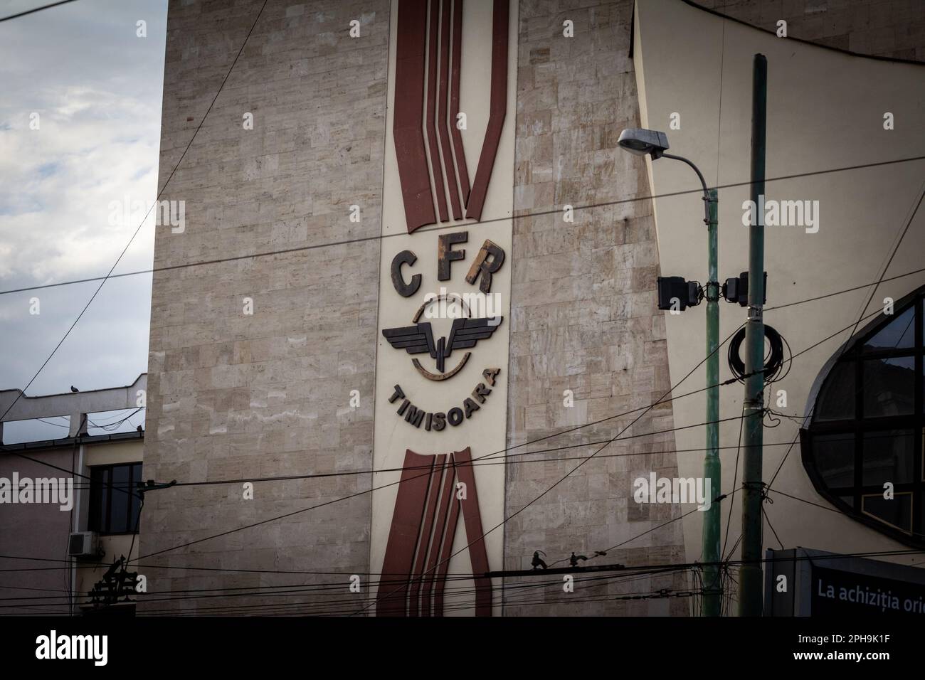 PIcture of the facade of the Timisoara Train station with the logo of ...
