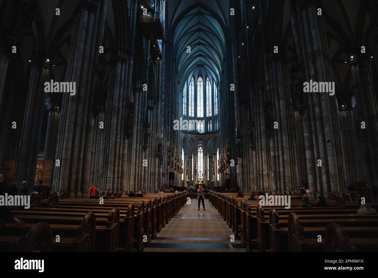 Picture of the cologne cathedral seen from the inside with a tourist ...