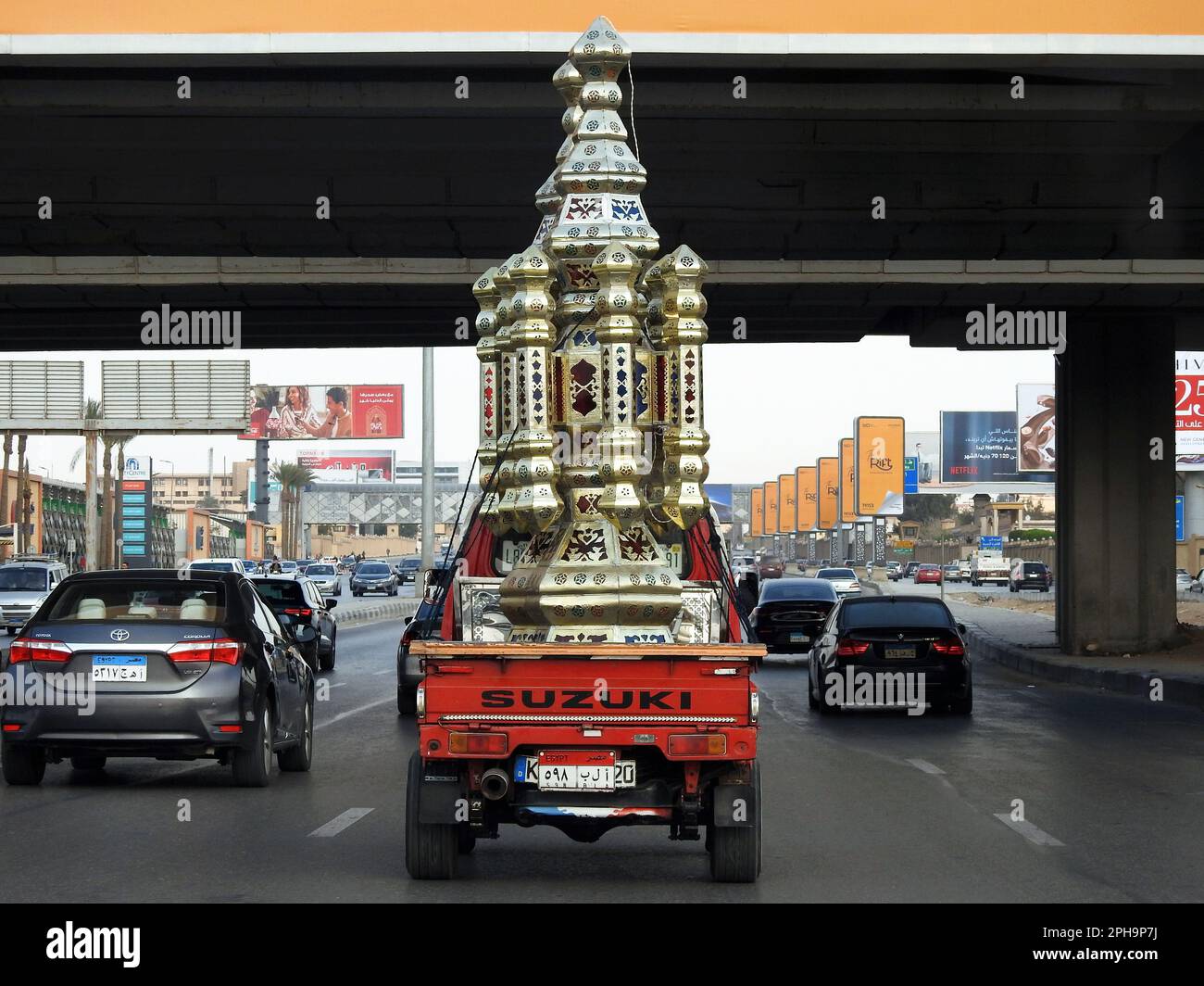 Cairo, Egypt, March 23 2023: A car transporting large Fanous lantern Islamic lamp of Ramadan to ...