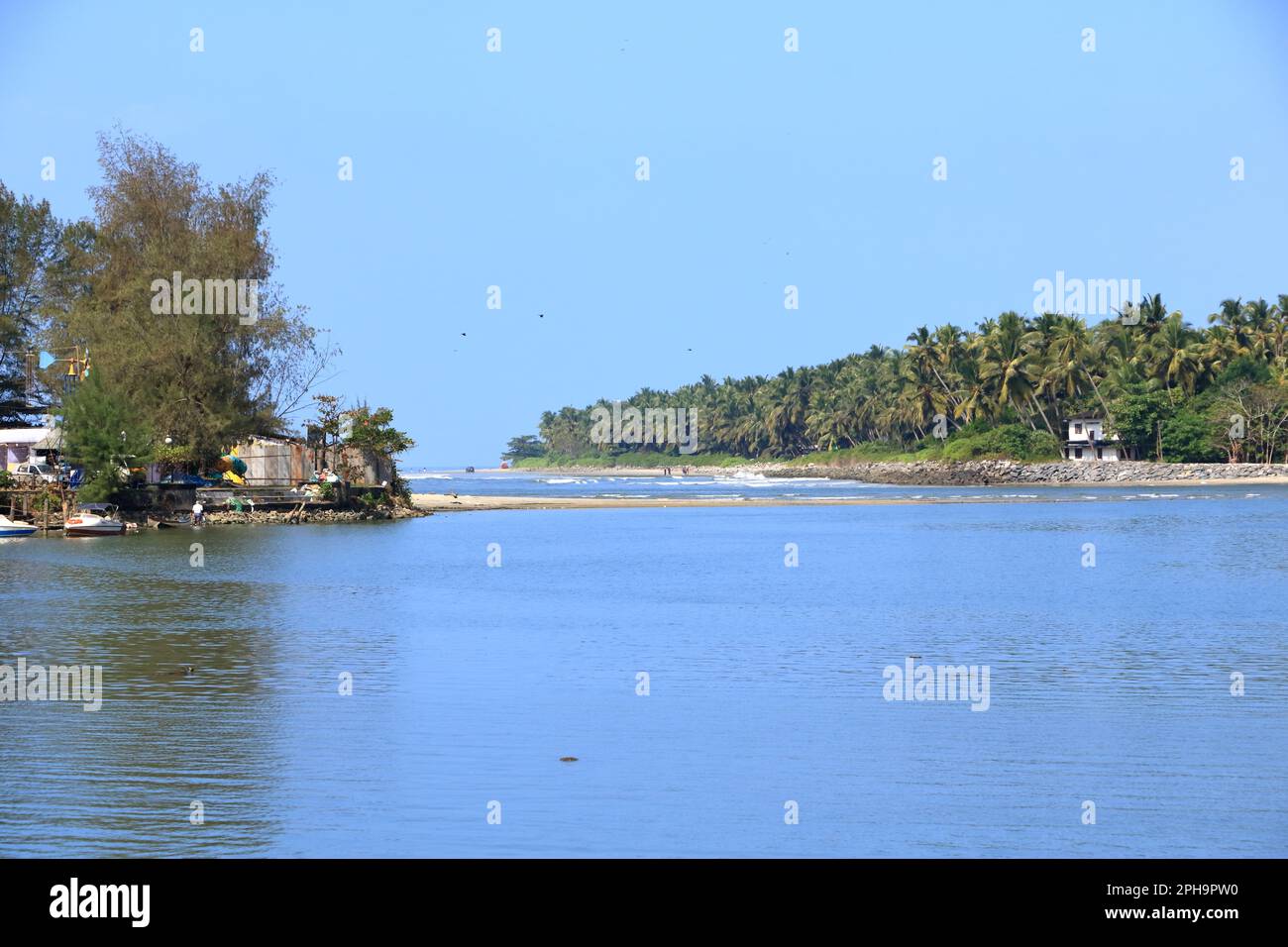 the lake and backwaters behind Dharmadam beach in Kannur, Kerala in ...