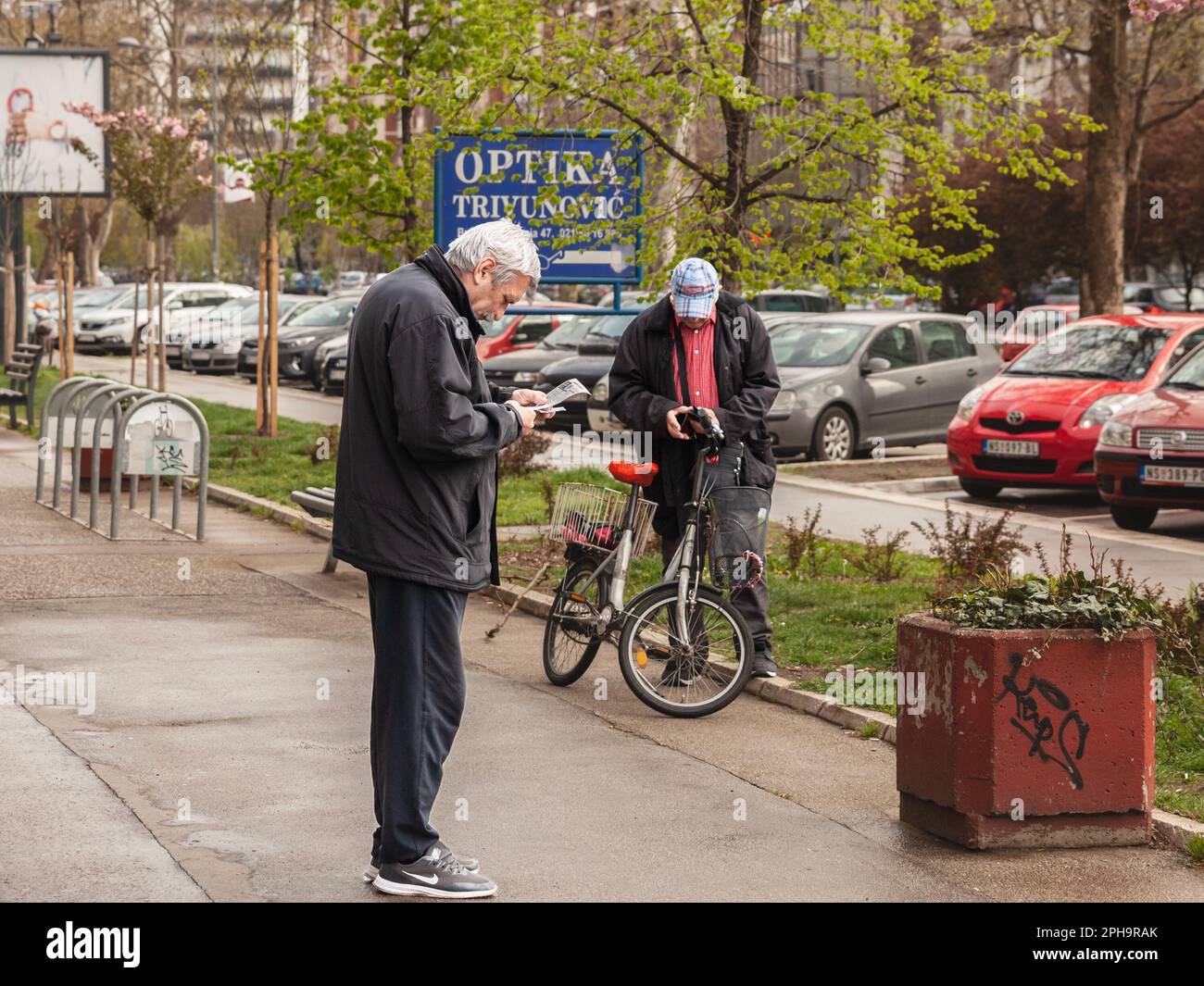 Old mean checking a groceries bill hi-res stock photography and images ...