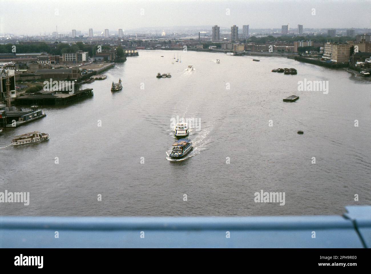 London. 1984. A view looking east from the upper footway of Tower Bridge, spanning the River ...