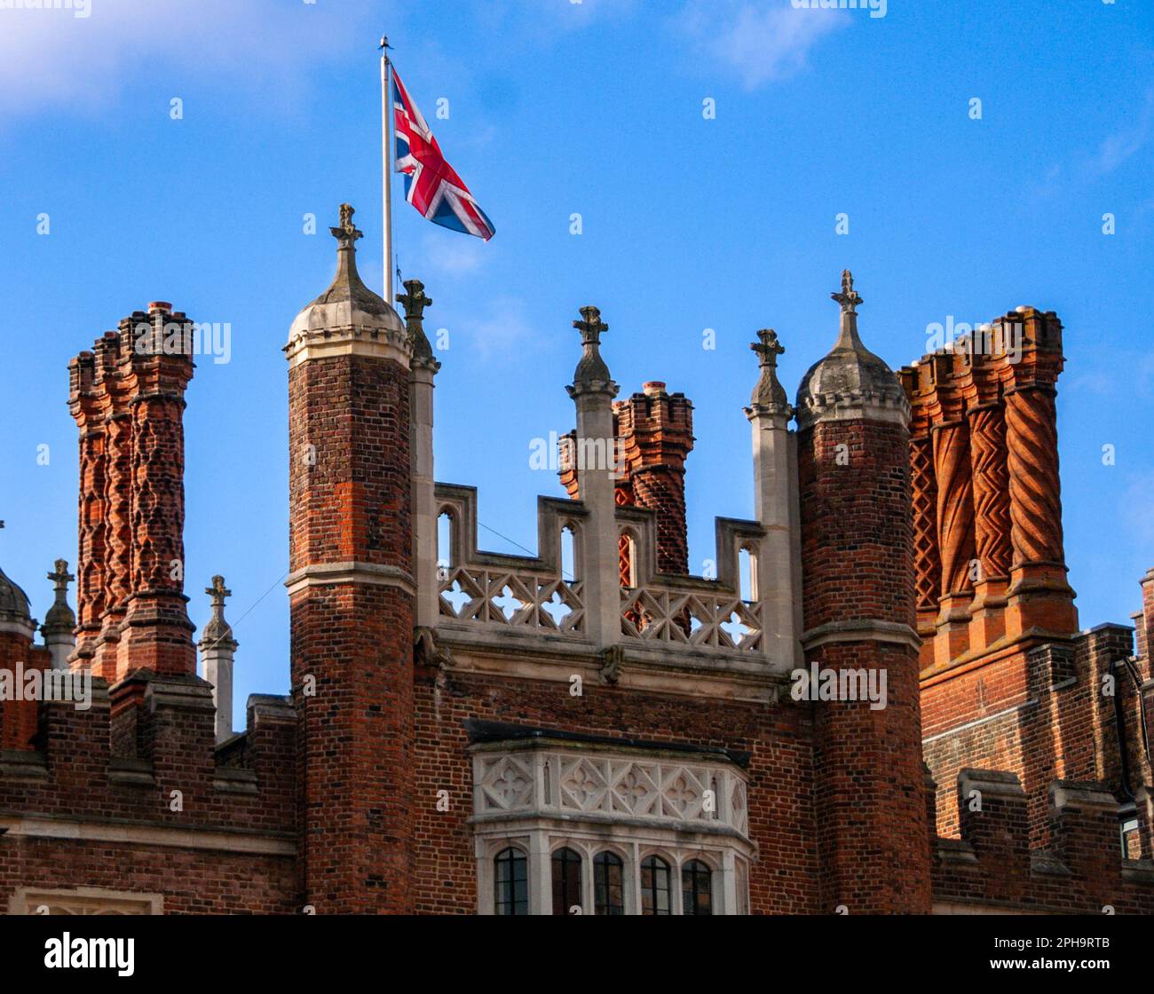 The union flag flying on top of the building with many tall columns ...