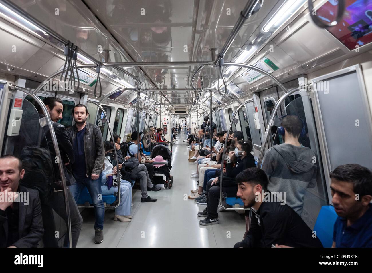 Picture of a metro of Istanbul Metro, on Line 2, with people sitting ...