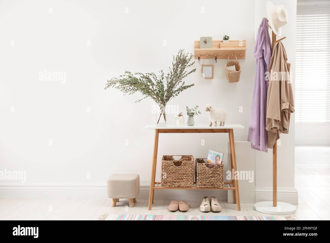 Modern hallway interior with table, clothes rack and key holder Stock ...
