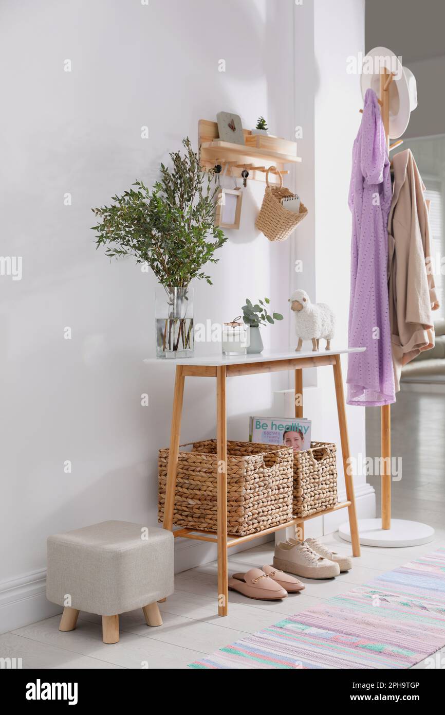 Modern hallway interior with table, clothes rack and key holder Stock ...