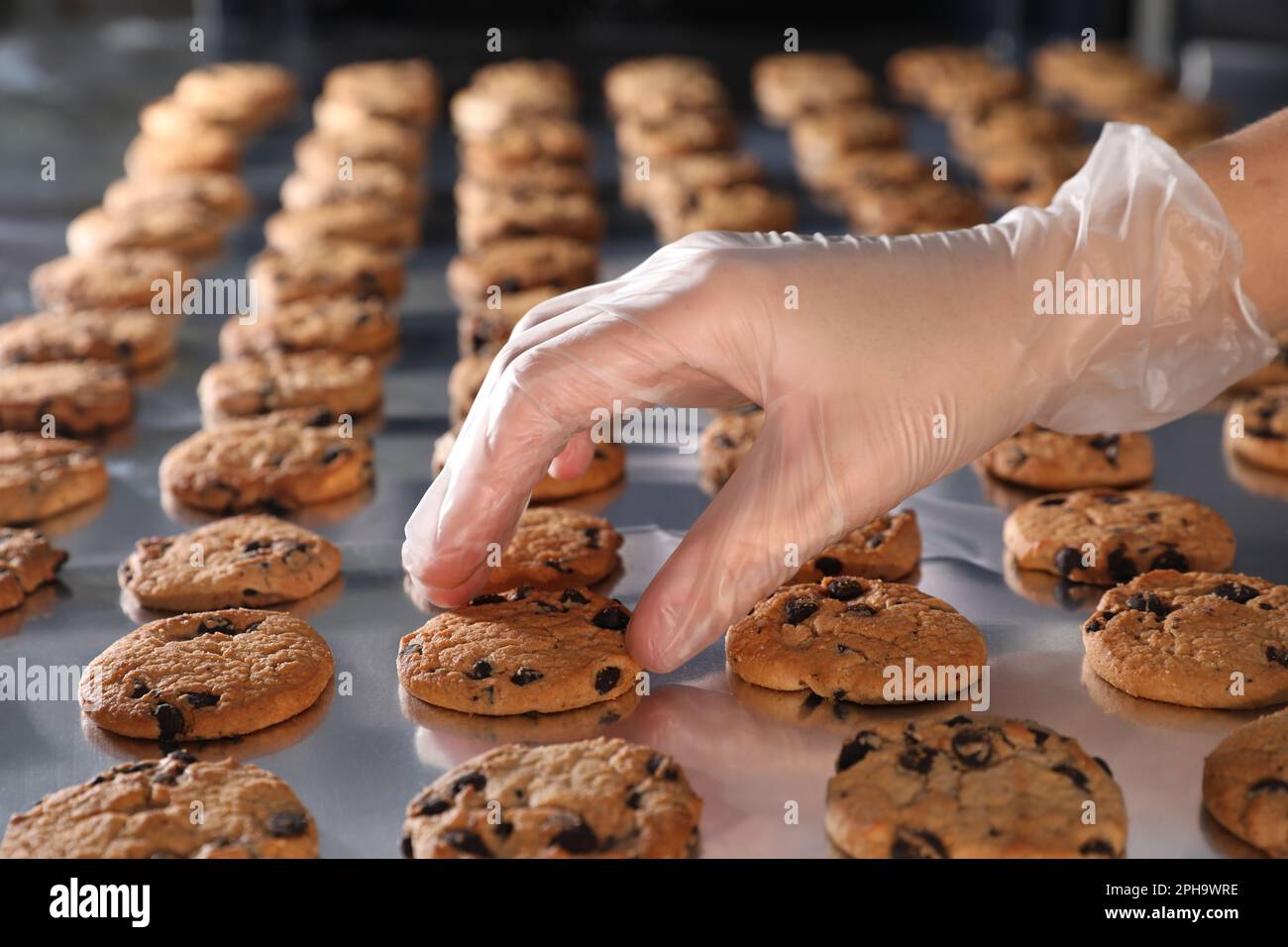 Hand taking cookie from hi-res stock photography and images - Alamy