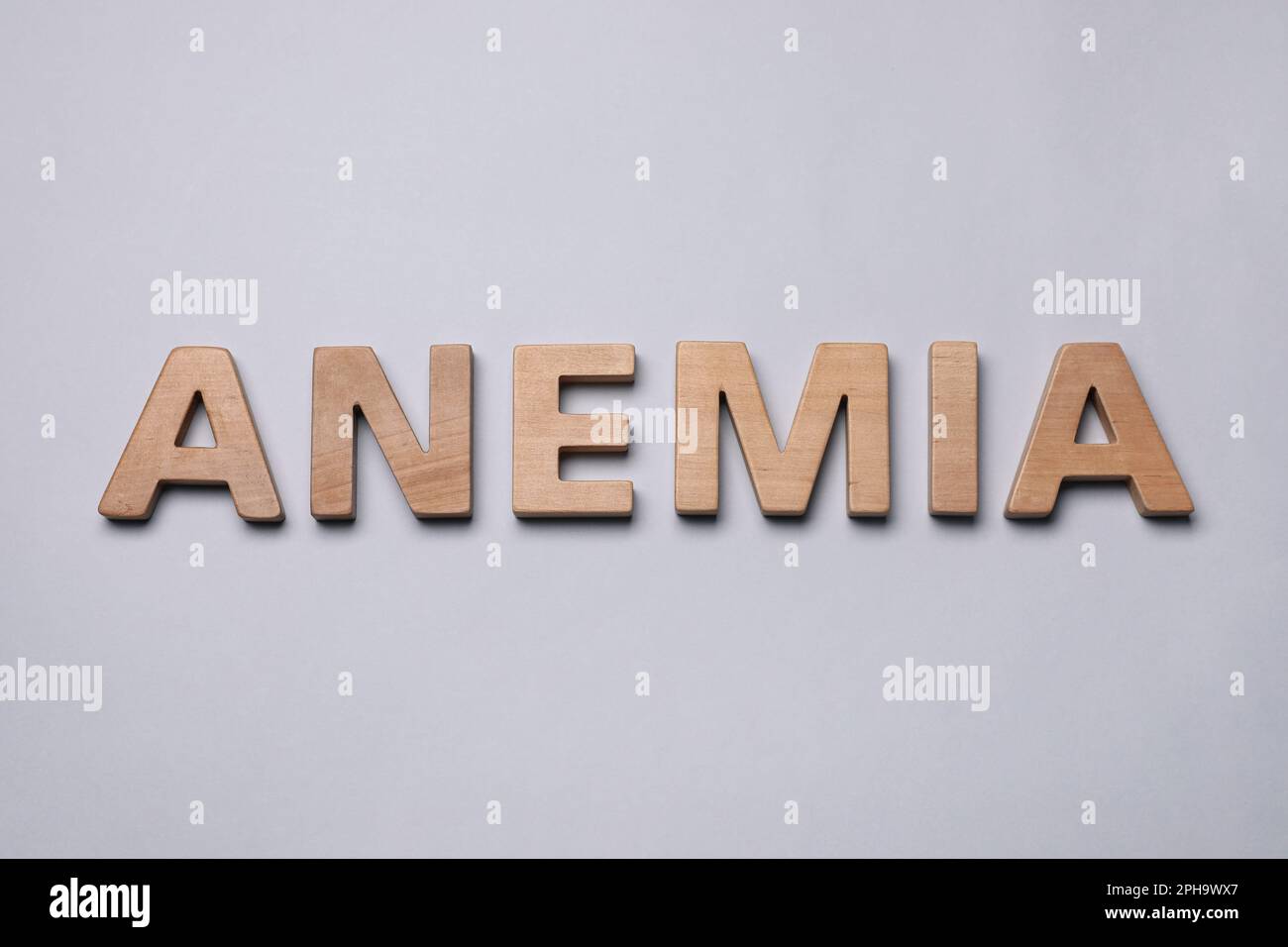 Word Anemia made of wooden letters on grey background, flat lay Stock ...