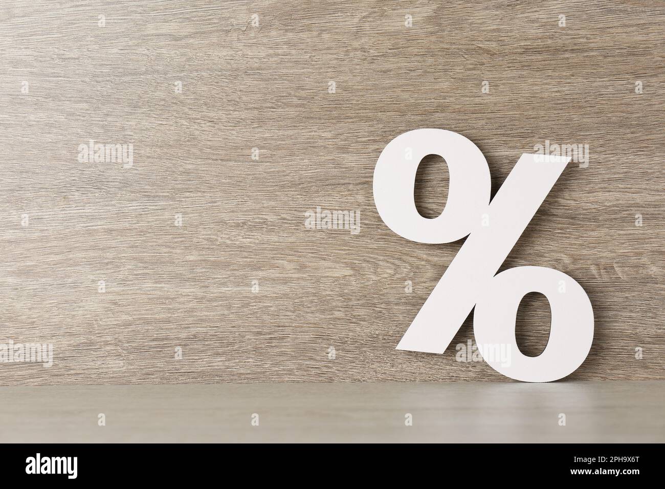 Paper percent symbol cutout on wooden background. Space for text Stock ...