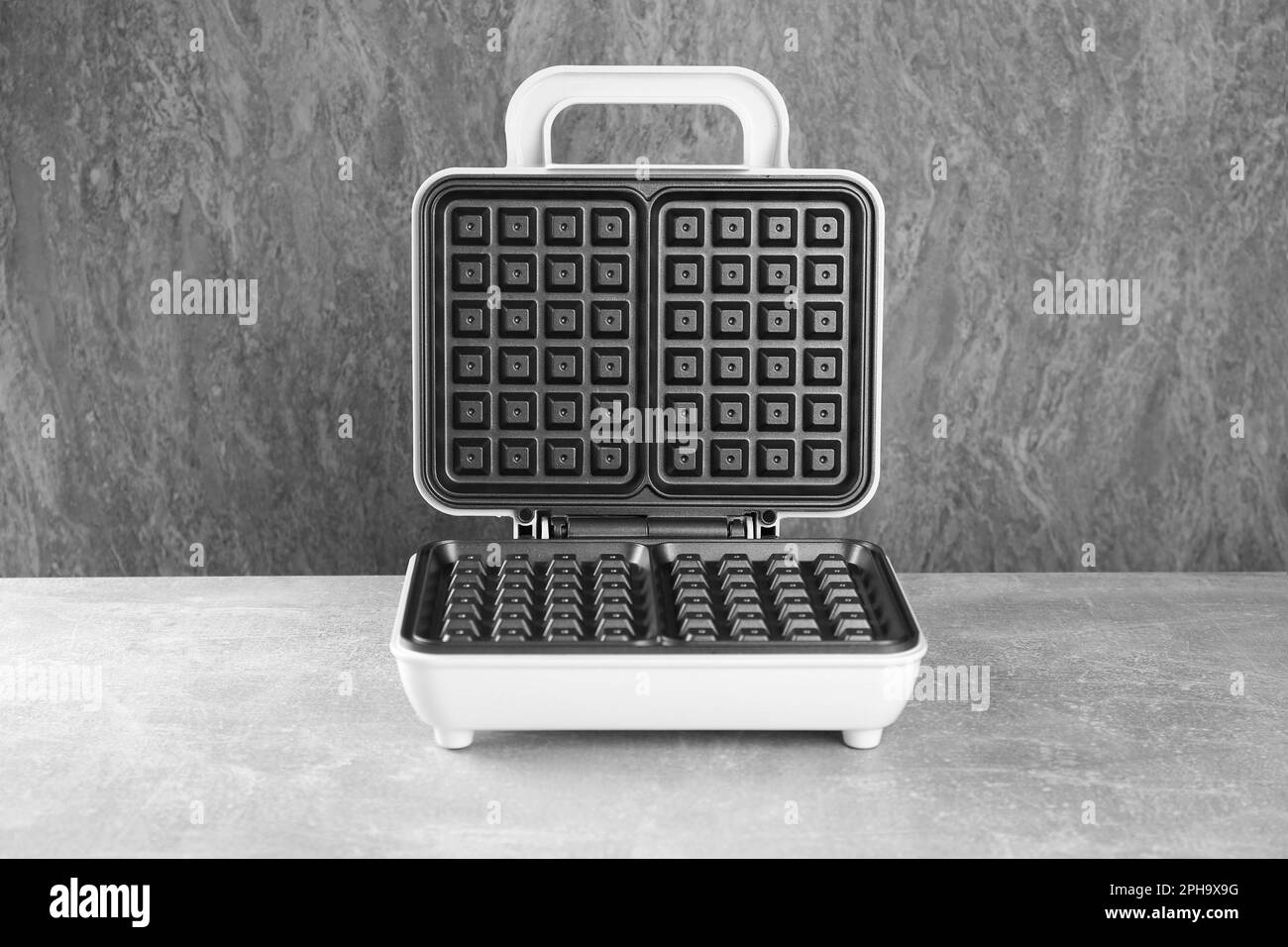 Cooking breakfast electric waffle Black and White Stock Photos & Images ...