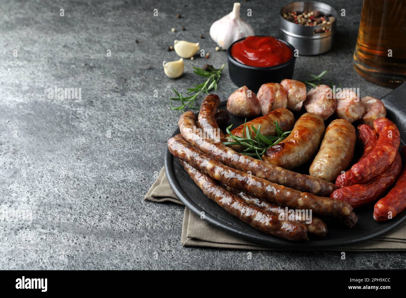 Set of different tasty snacks on dark grey table, space for text Stock ...