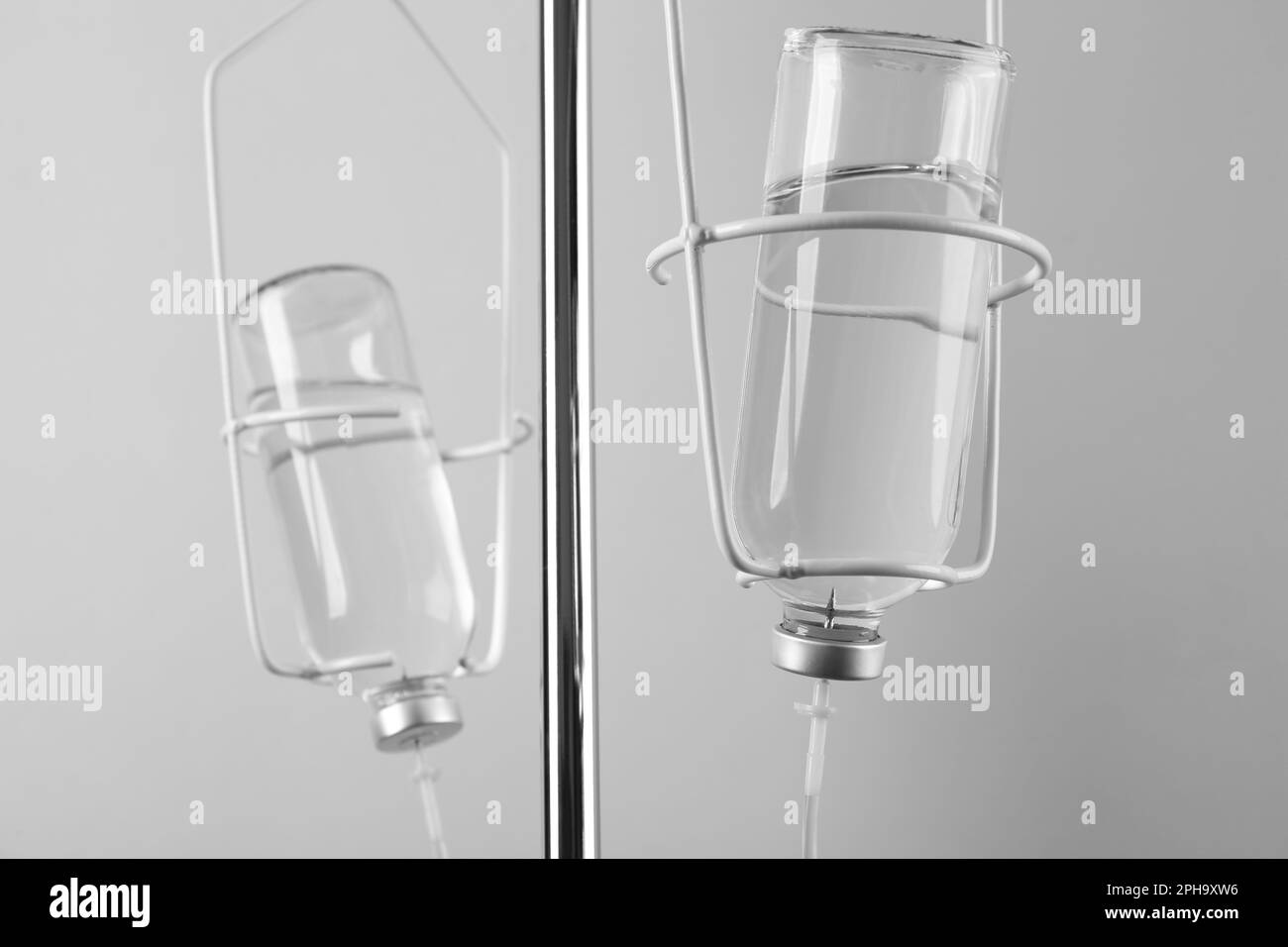 IV infusion set on light grey background Stock Photo - Alamy