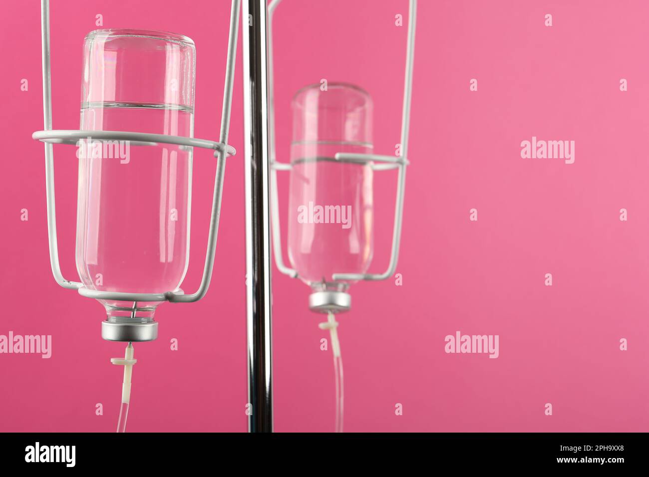 IV infusion set on pink background. Space for text Stock Photo - Alamy