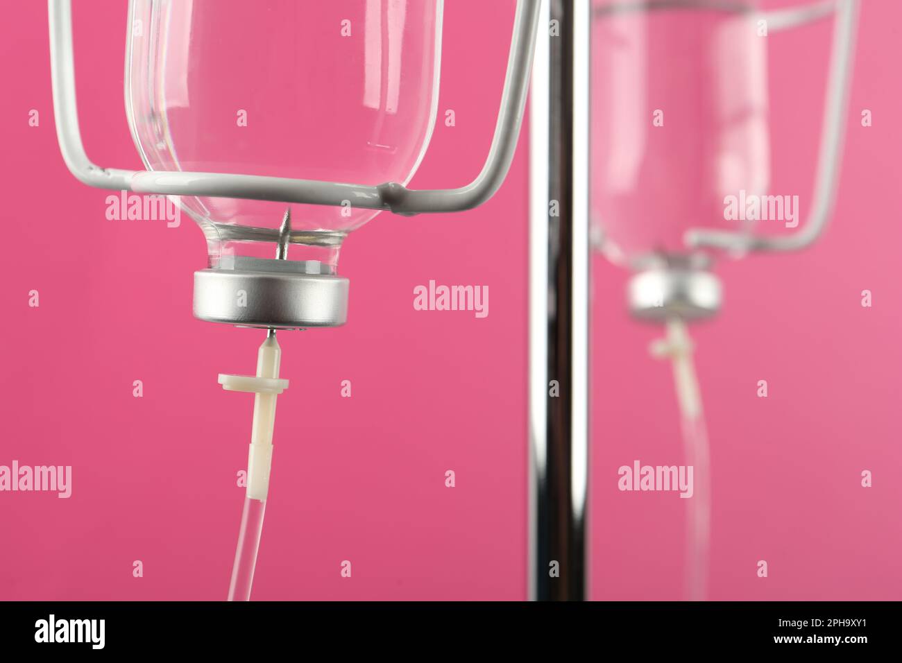 IV infusion set on pink background, closeup view Stock Photo - Alamy