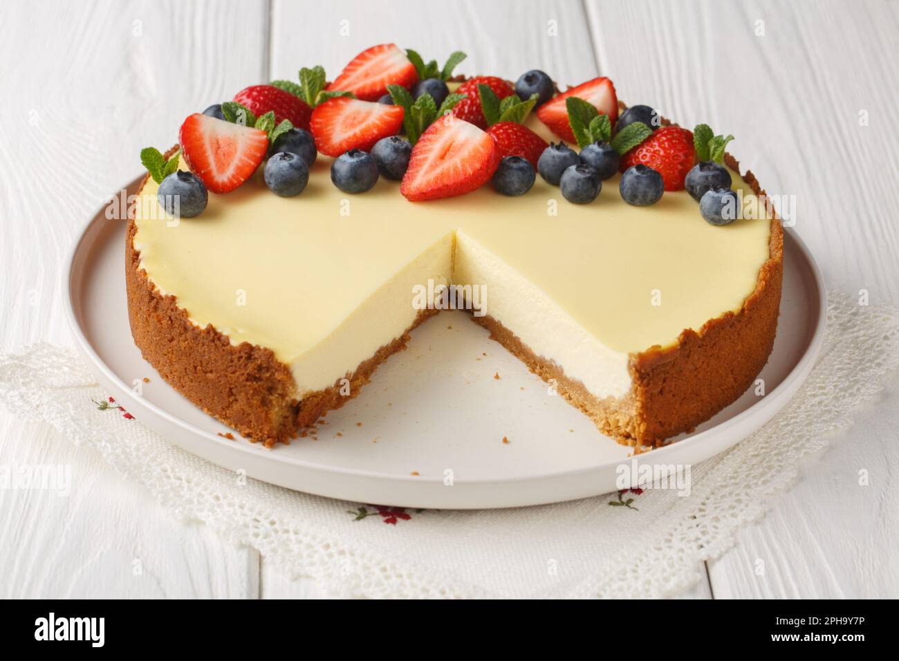 Homemade classic New York cheesecake cut closeup on the plate on the ...