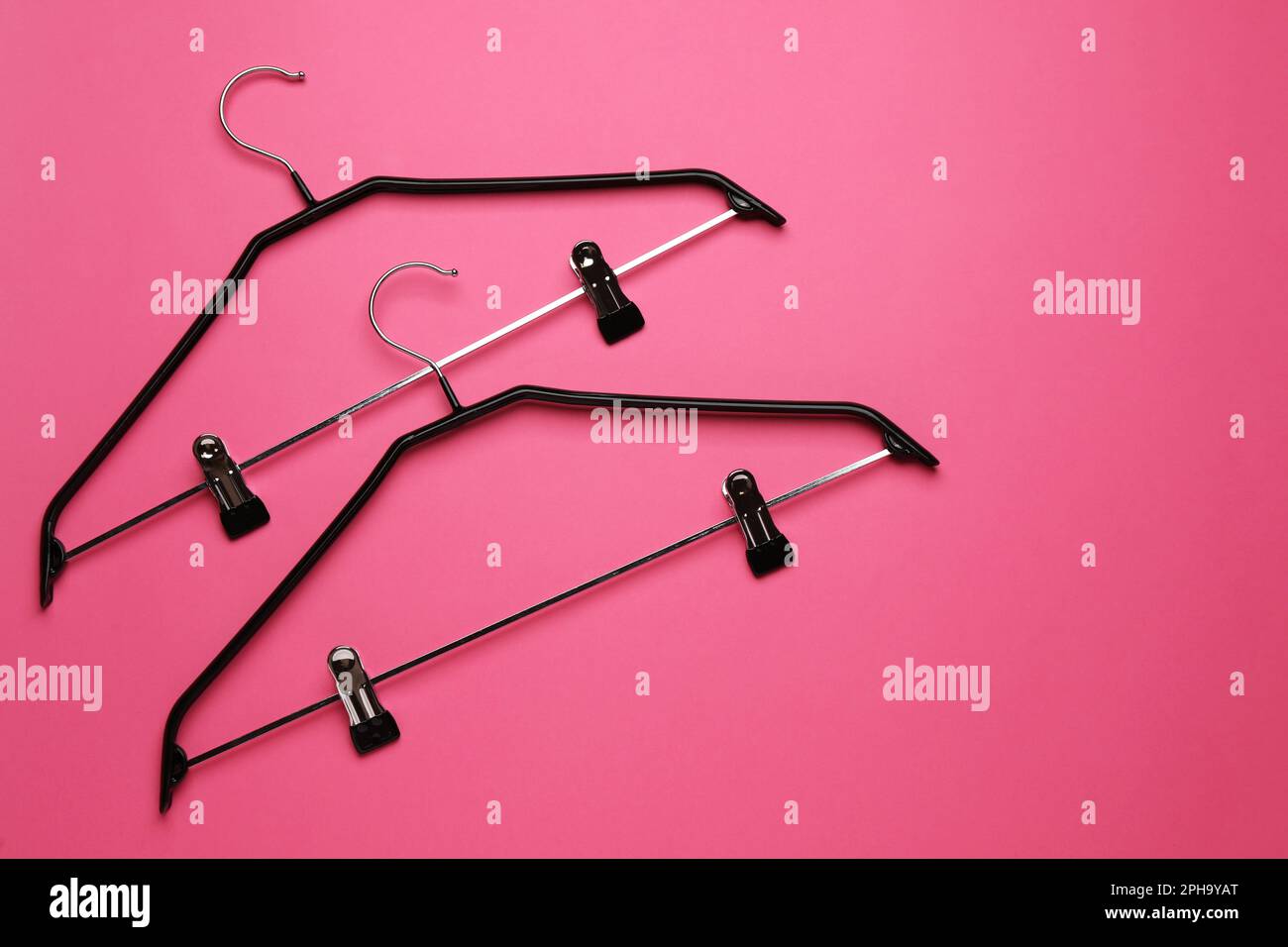 Two hangers on pink hi-res stock photography and images - Alamy