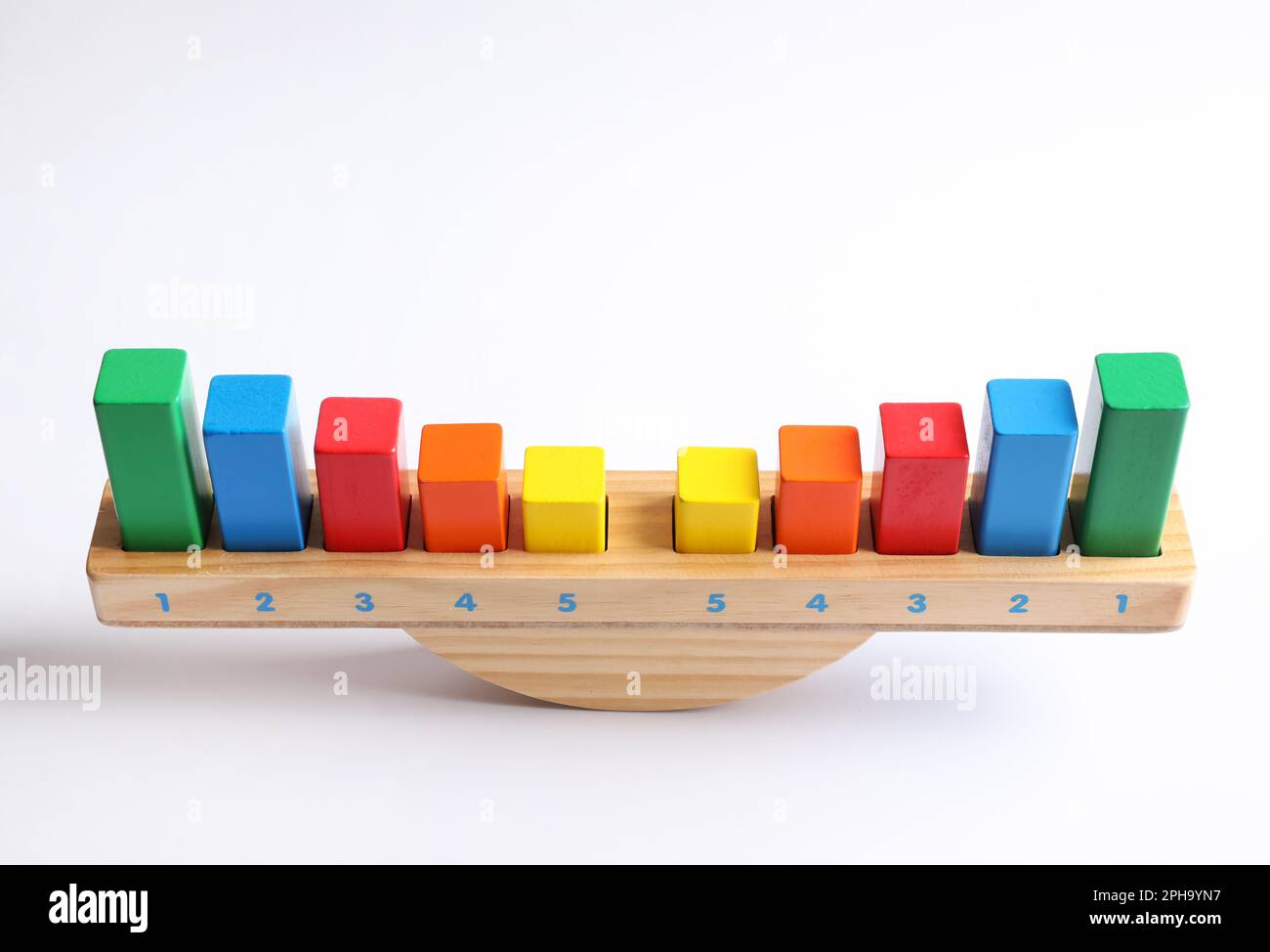 Wooden scale with colorful blocks isolated on white. Montessori toy ...