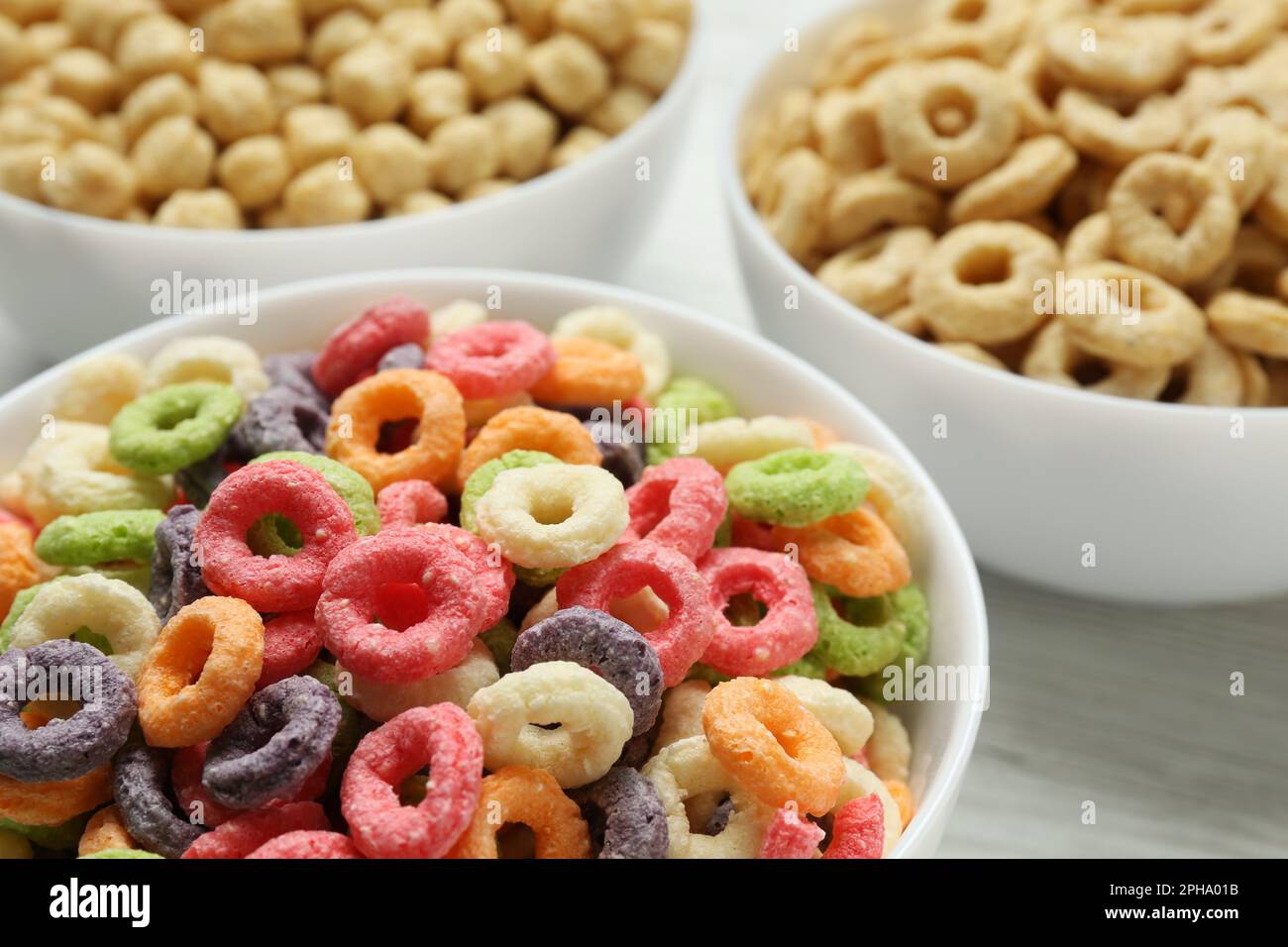 Different delicious breakfast cereals in bowls, closeup Stock Photo - Alamy