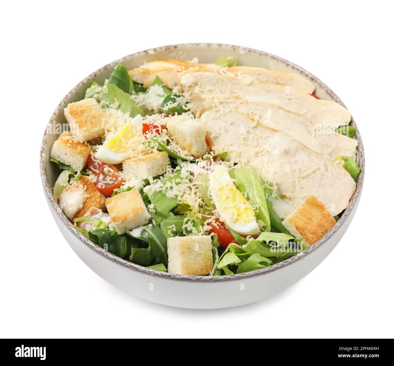 Delicious Caesar salad in bowl isolated on white Stock Photo - Alamy